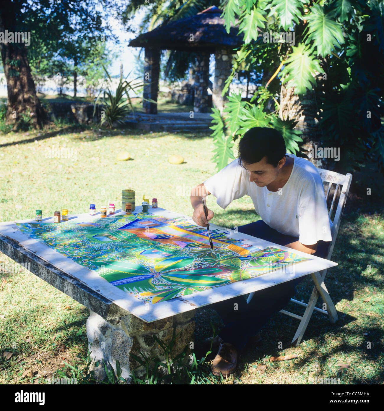 Local artist, naive painter at work, Seychelles Stock Photo - Alamy