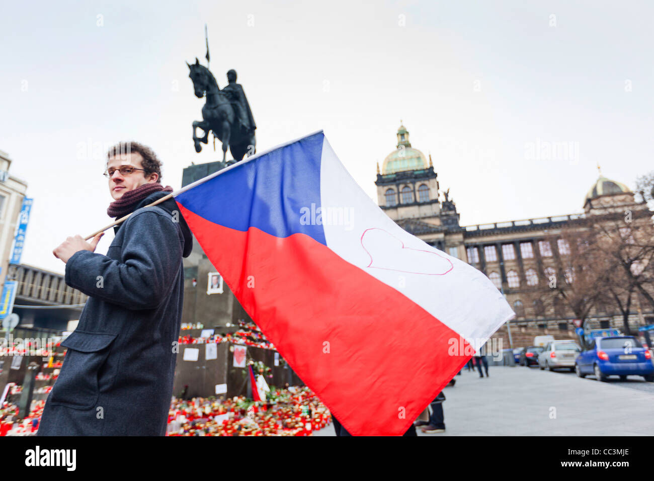 Student Adam Rames walks with Czech national flag painted with symbolic ...
