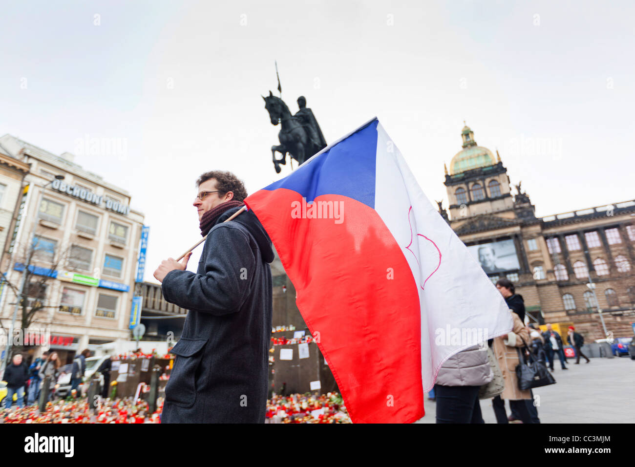Student Adam Rames walks with Czech national flag painted with symbolic ...