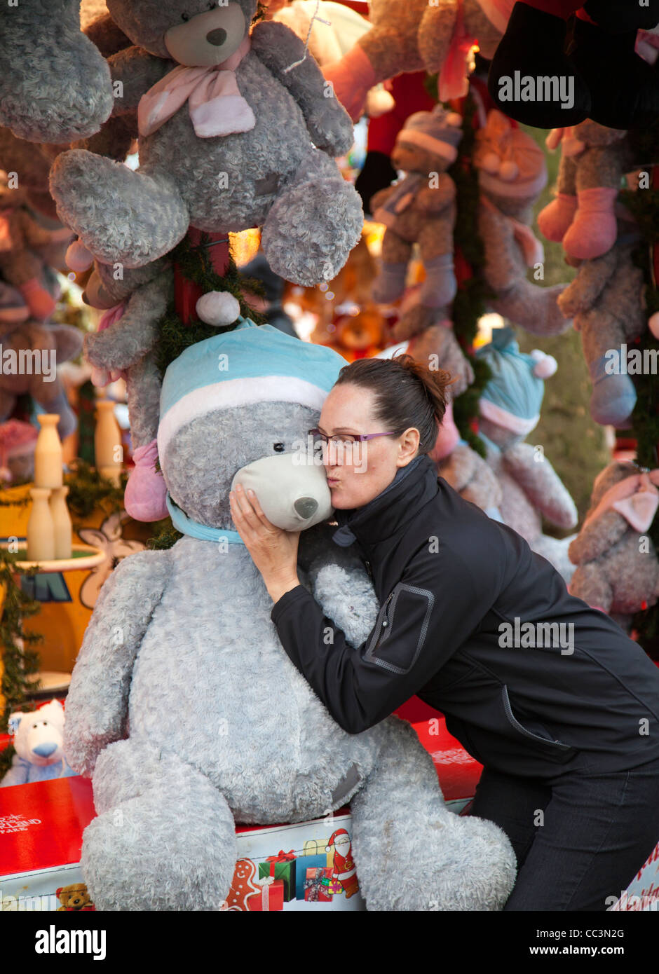 Woman kissing soft toy Stock Photo - Alamy