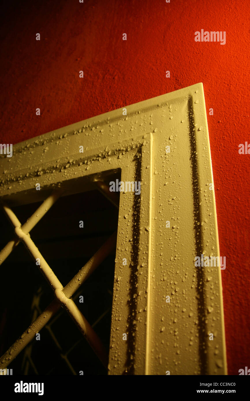 rain drops on metal door frame on house at night Stock Photo - Alamy