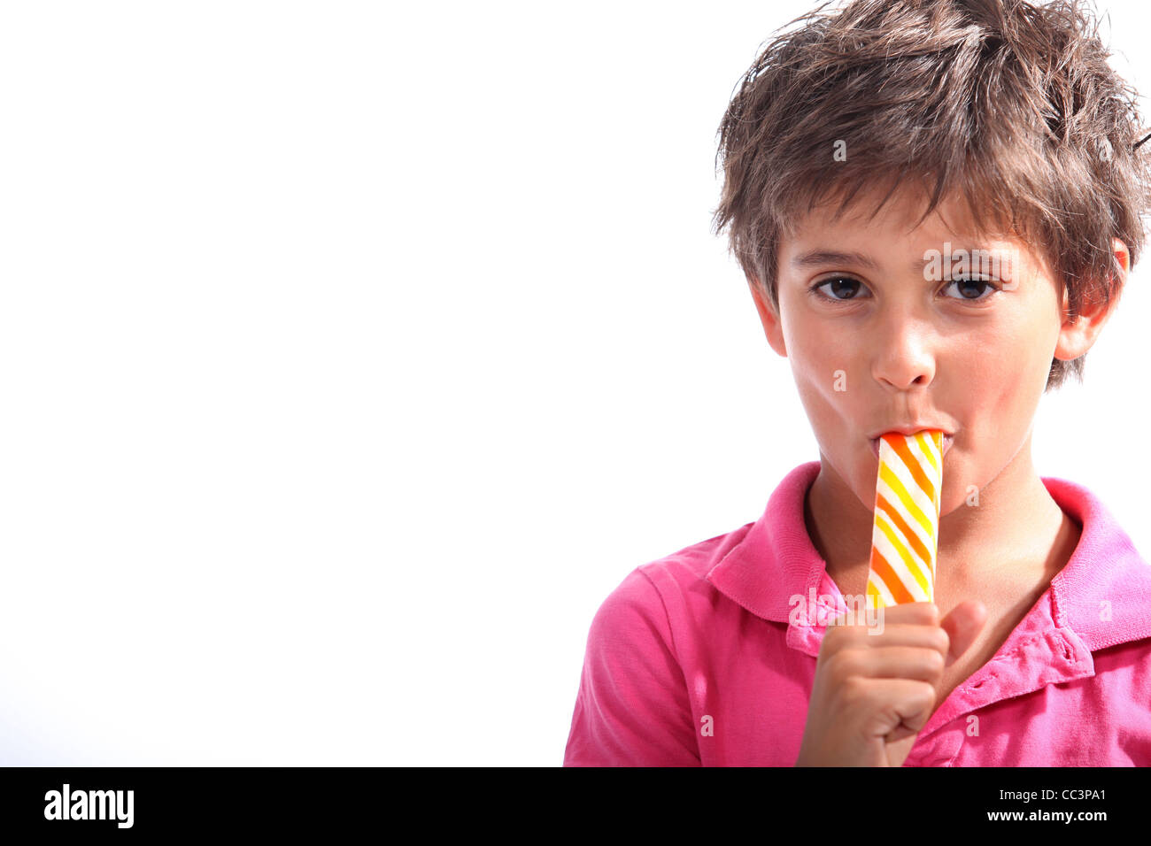 Boy sucking on lollipop hi-res stock photography and images - Alamy