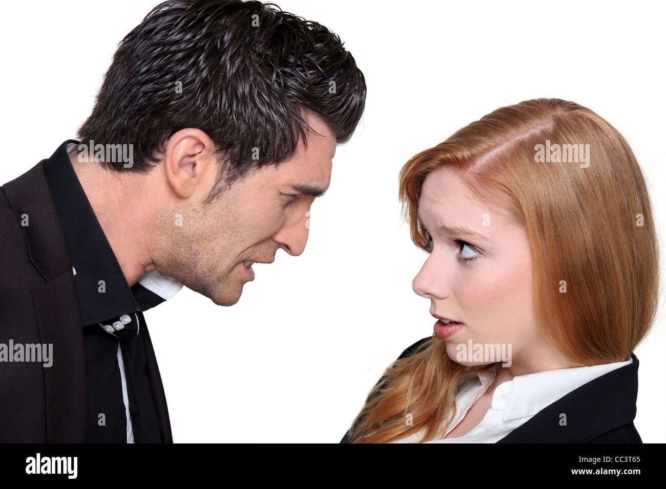 Man in smart suit and young woman arguing Stock Photo - Alamy