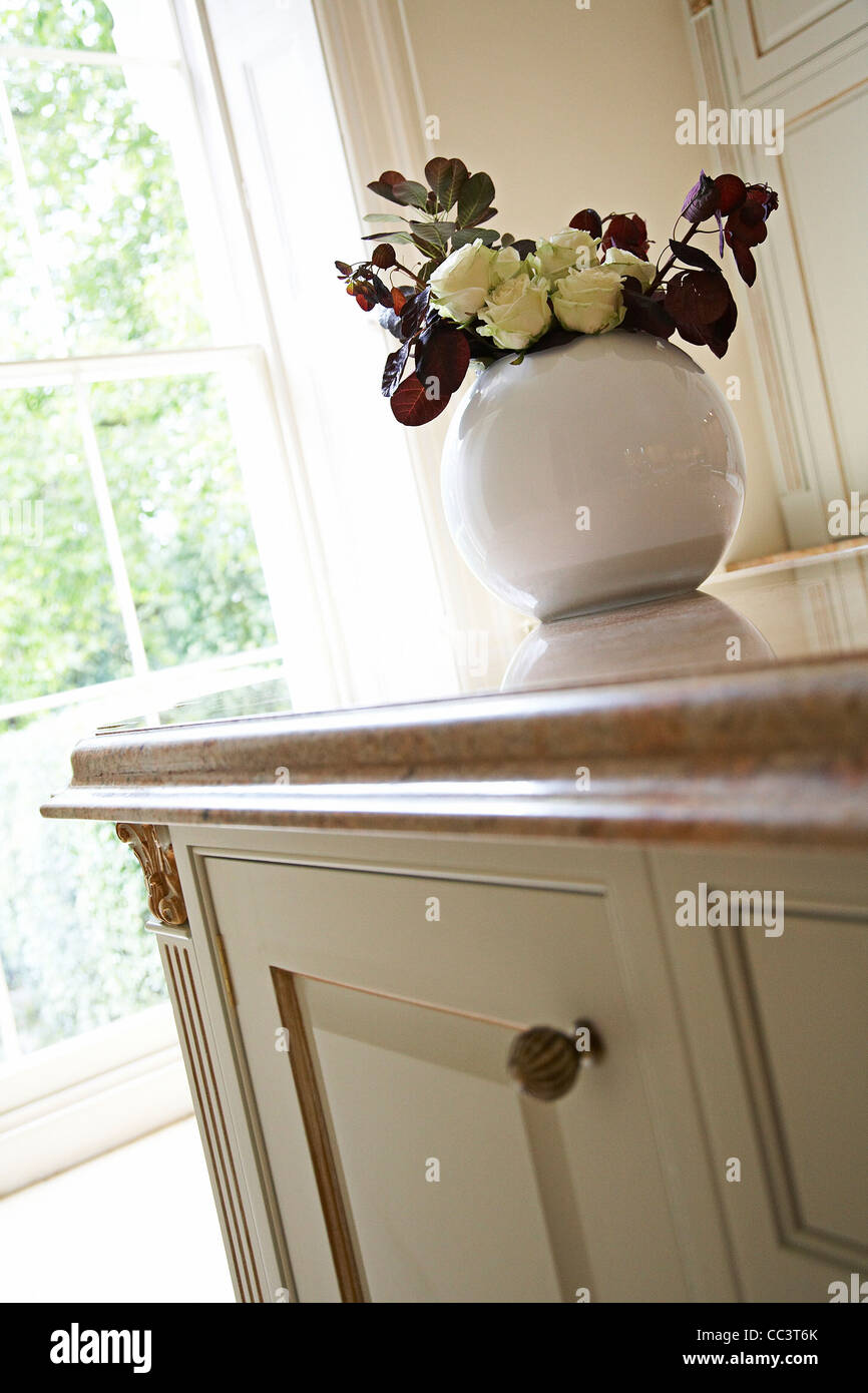 Large white vase in a kitchen with flowers Stock Photo - Alamy