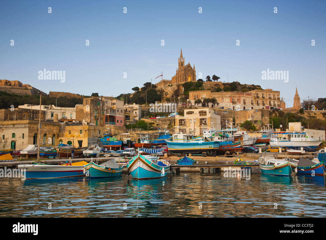 Malta, Gozo Island, Mgarr, harbor view with traditional luzzu fishing ...
