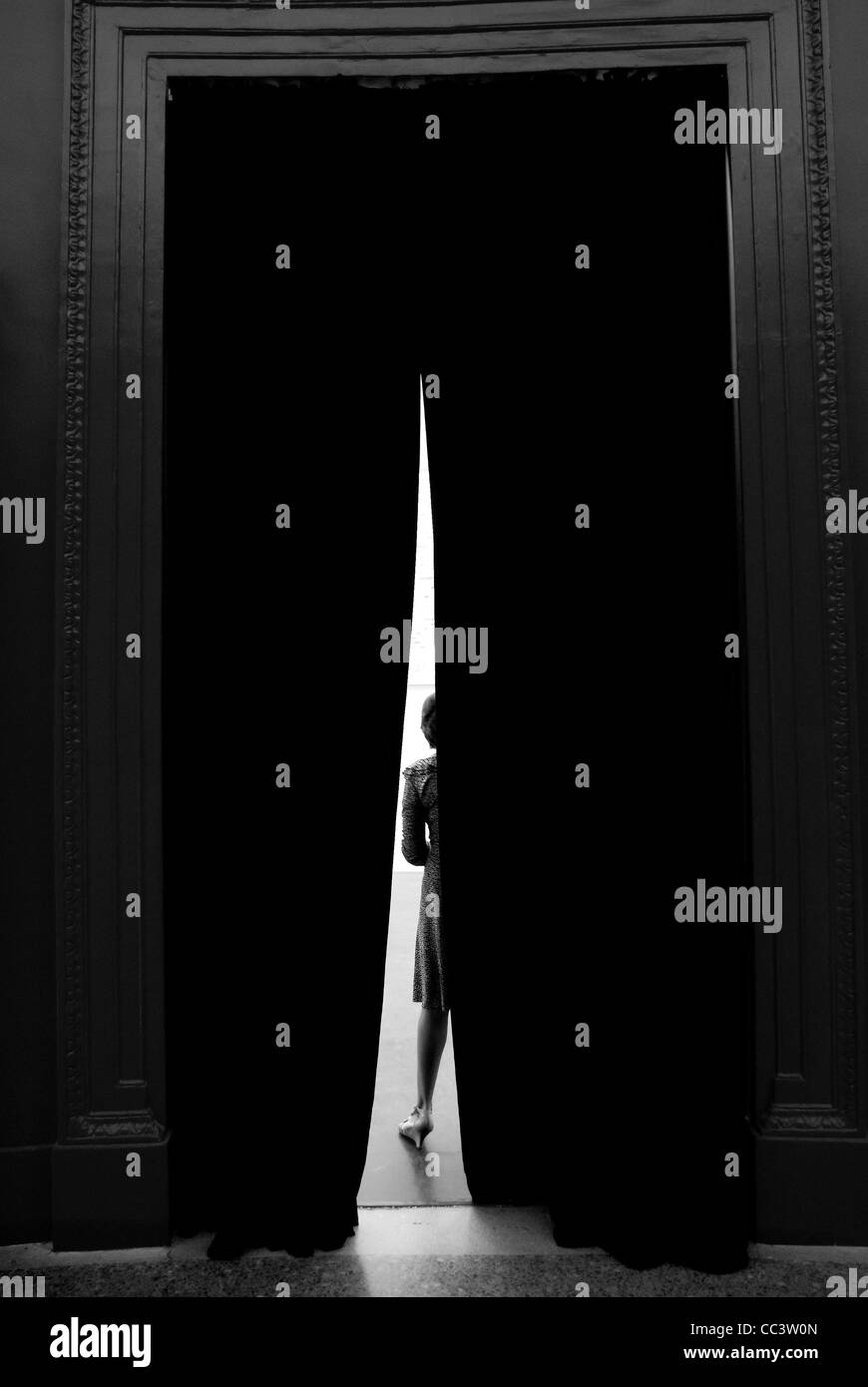 Woman behind curtain Stock Photo - Alamy