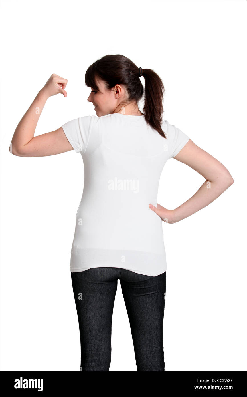Young girl showing the back of her t-shirt Stock Photo - Alamy