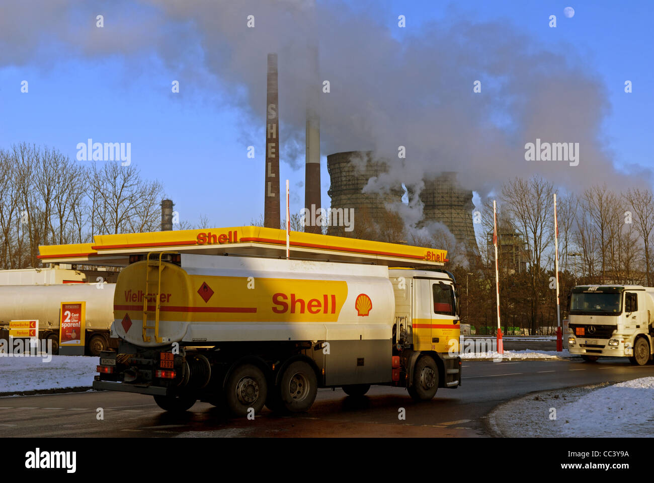 Shell oil refinery, oil tankers and petrol station Stock Photo - Alamy