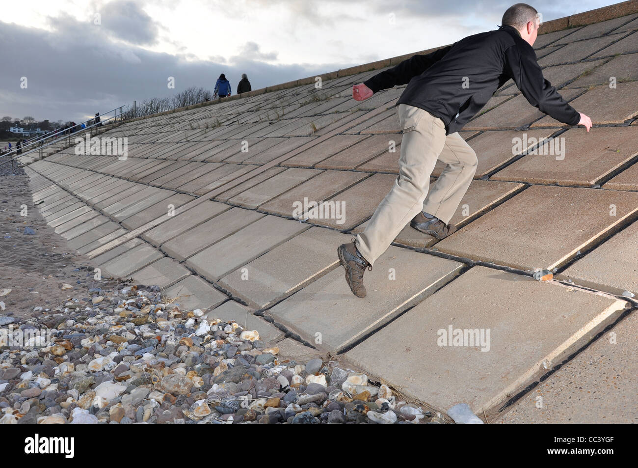Man running up concrete slope Stock Photo - Alamy