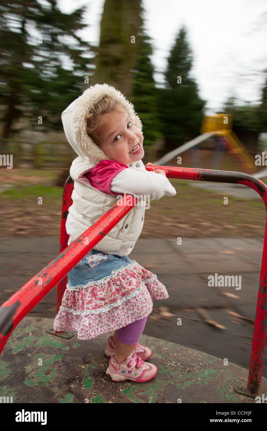 Playground roundabout hi-res stock photography and images - Alamy