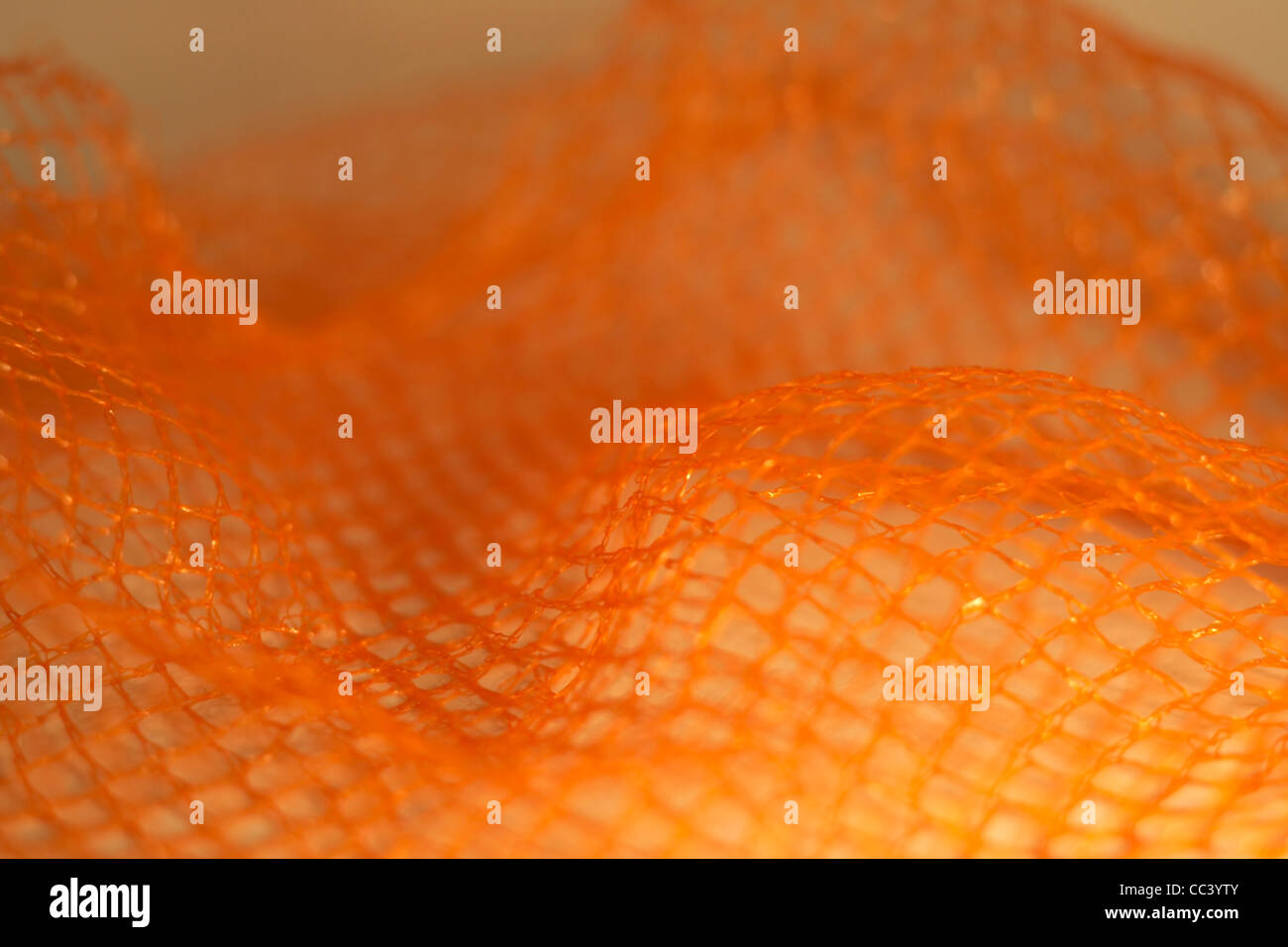 wavy orange net background Stock Photo - Alamy