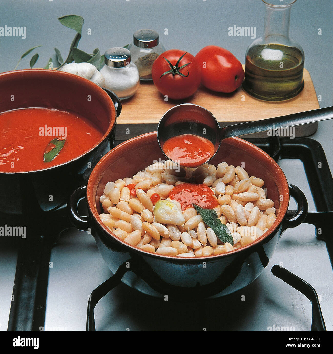 Cuisine: Beans In Tomato Sauce With Sage Step 3 Stock Photo - Alamy