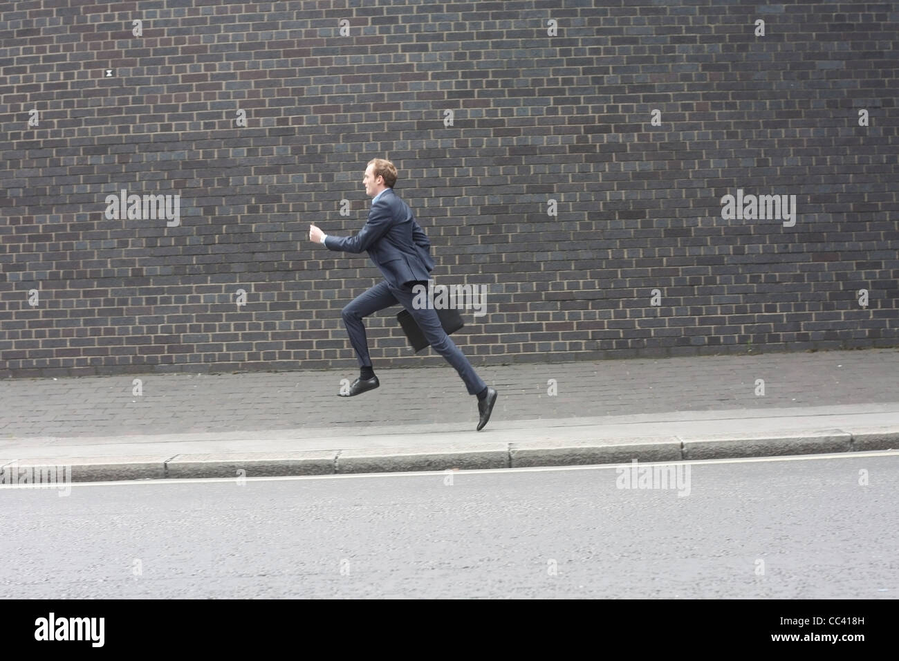 Business man running Stock Photo - Alamy