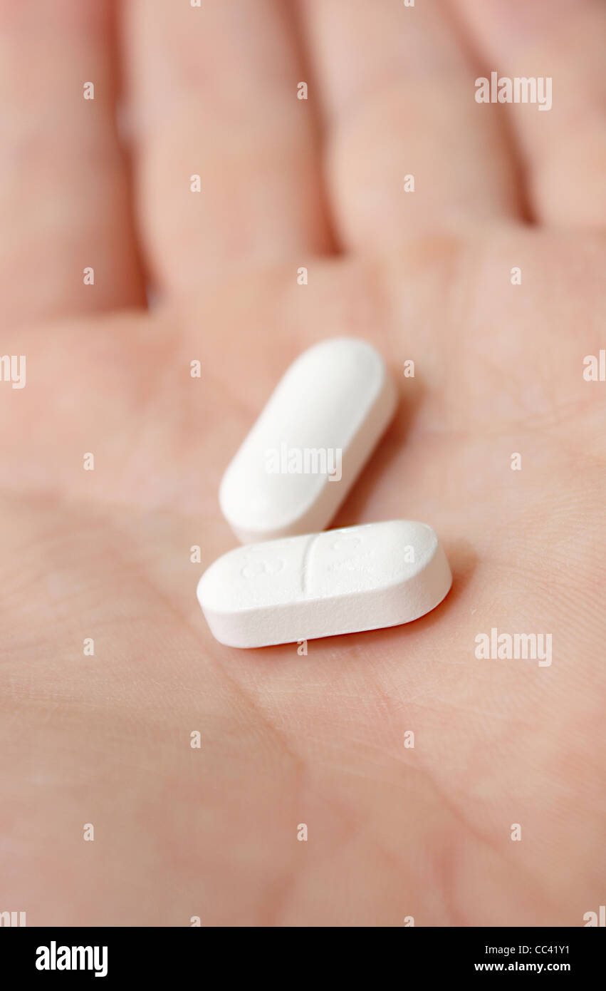 Medication pills hand hi-res stock photography and images - Alamy