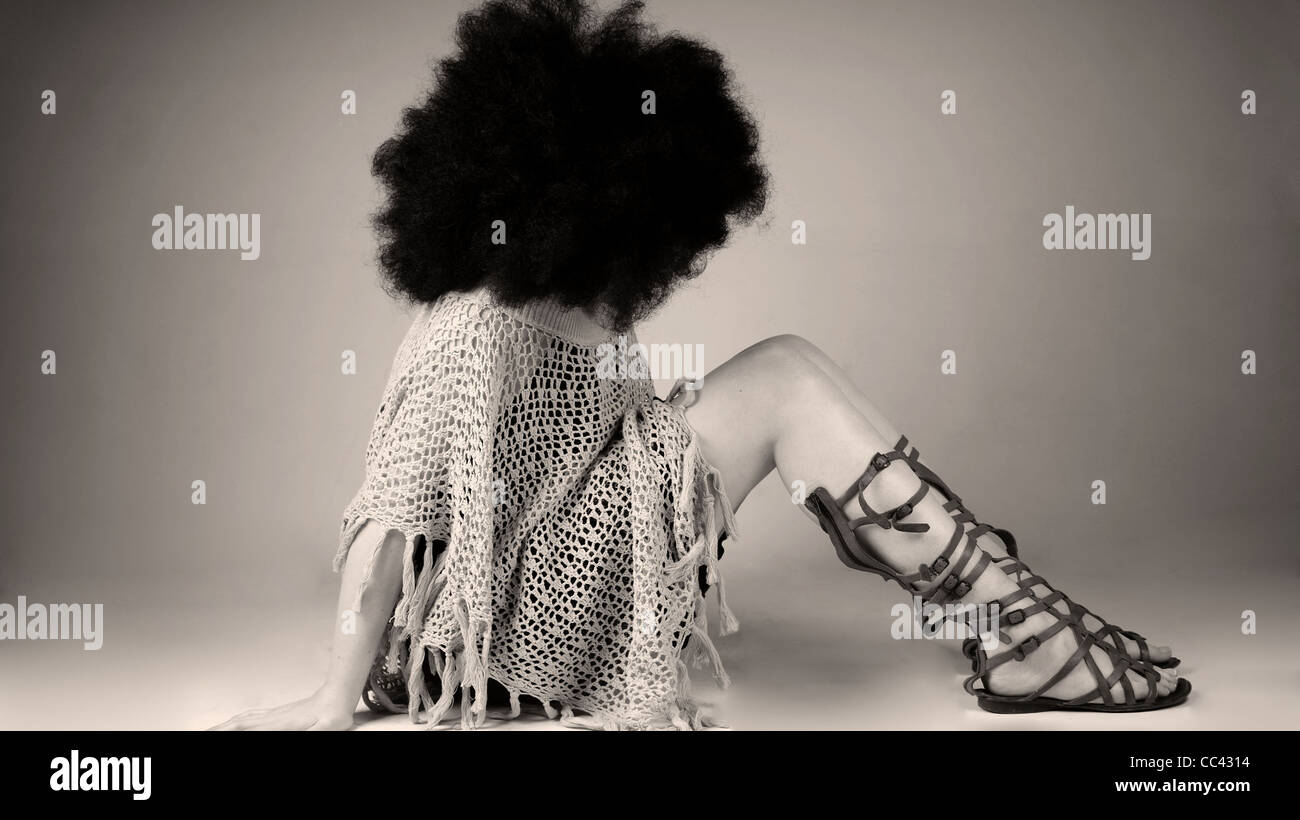 Woman with an afro wig on Stock Photo - Alamy