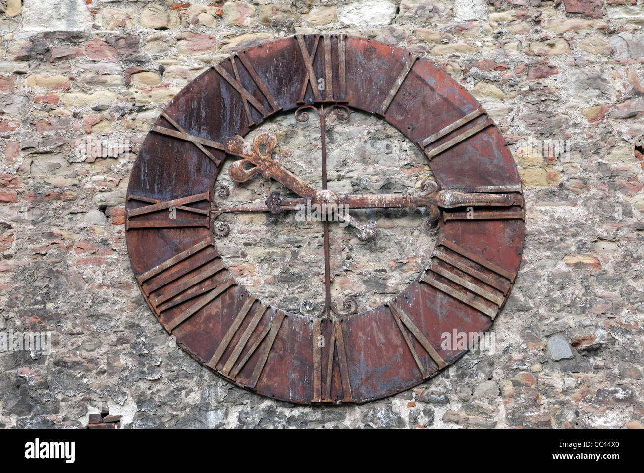 Rusty old clock on the wall Stock Photo - Alamy