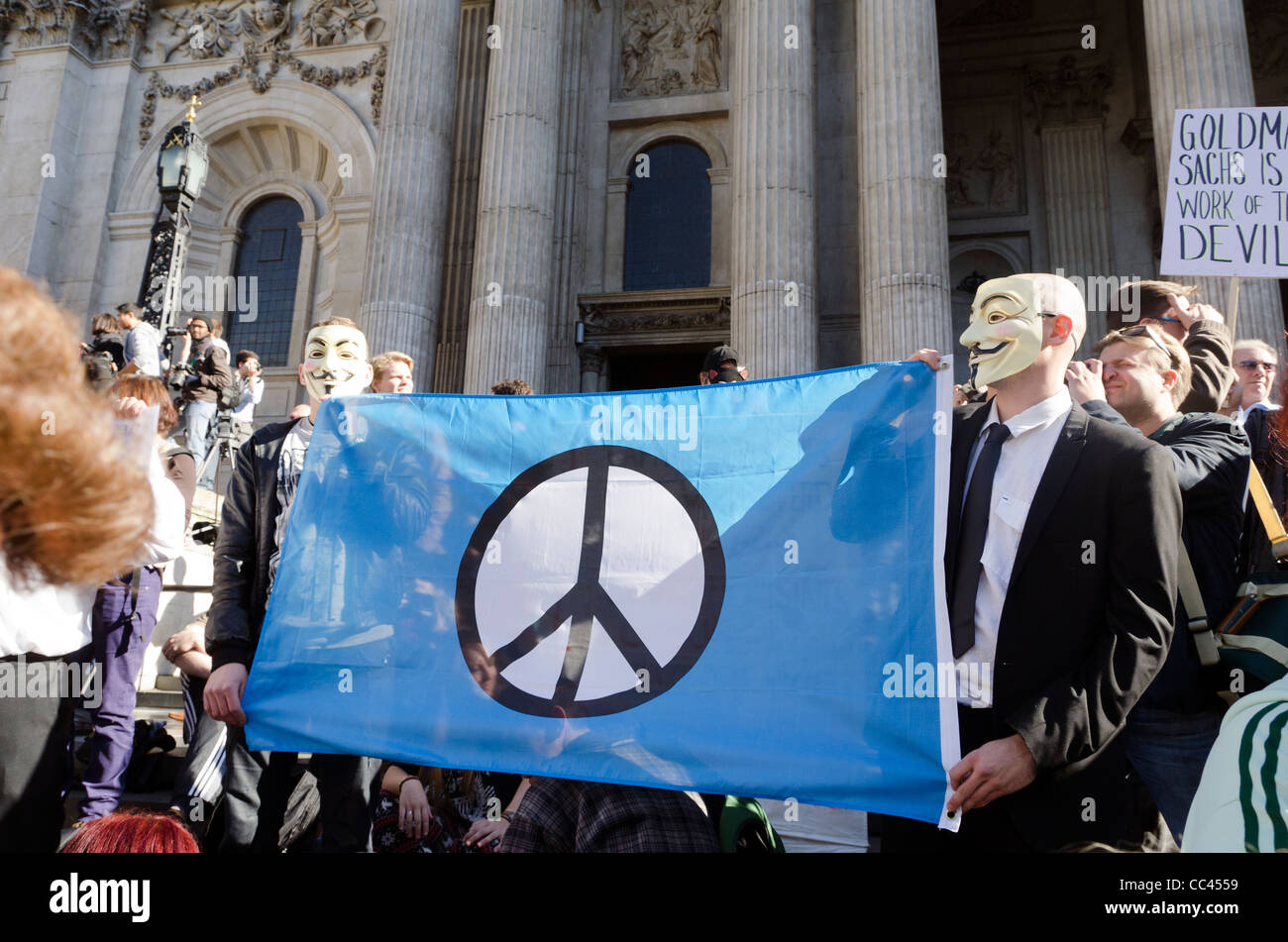 Protesters holding a peace flag during the Occupy London Stock Exchange ...