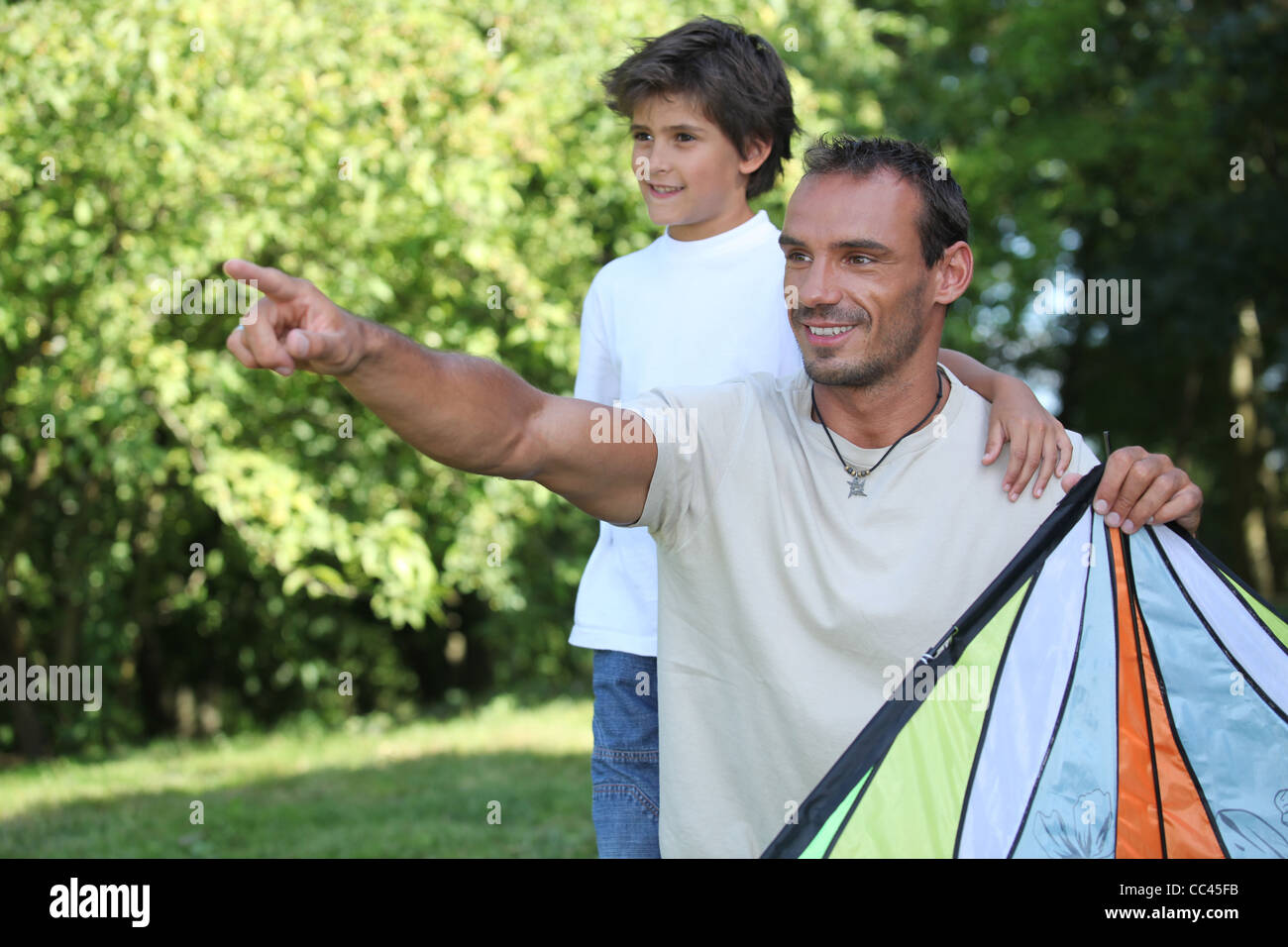 Father and son flying kite Stock Photo - Alamy