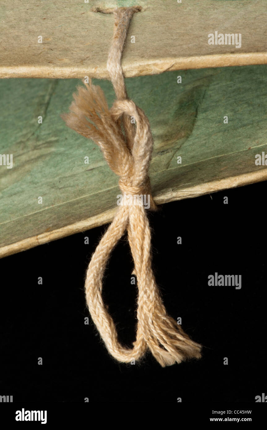 Old tattered folder tied with rope Stock Photo - Alamy