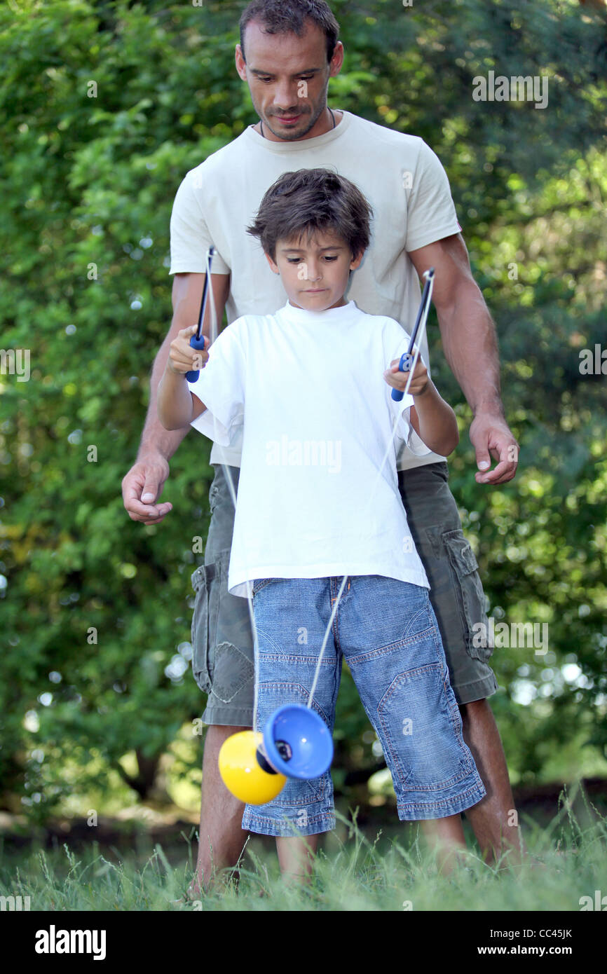 a little boy playing diabolo Stock Photo - Alamy