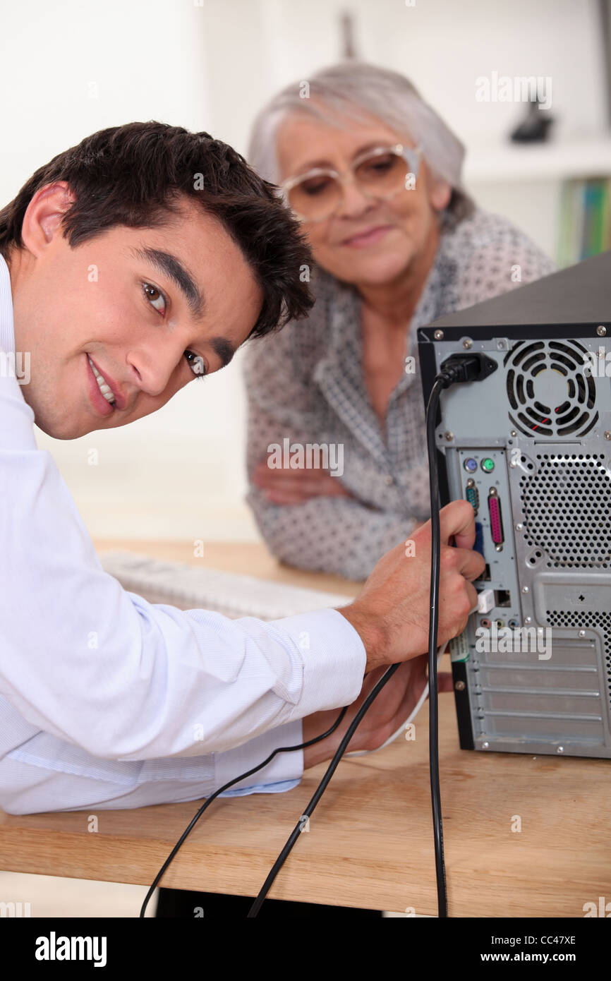 young man repairing a computer Stock Photo - Alamy