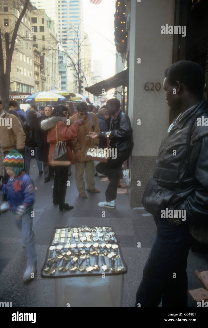 Vendors selling counterfeit and imitation goods line the sidewalks near ...