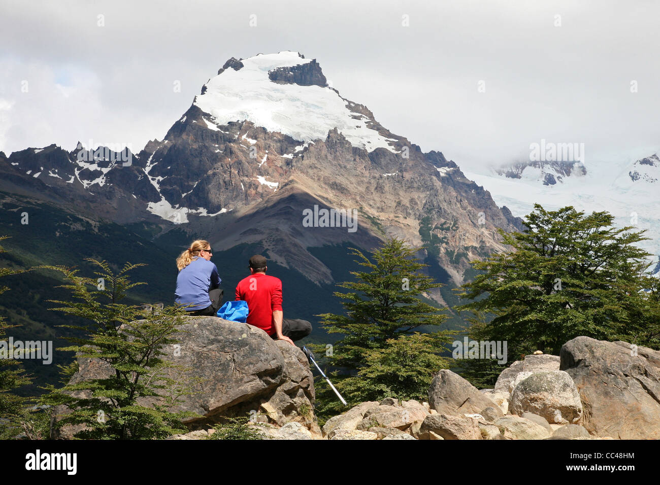 Hikers looking at mountain top in the Andes near El Chalten, Argentina ...
