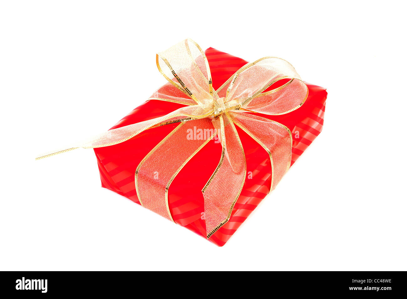 Big red present with golden ribbon over white background Stock Photo ...