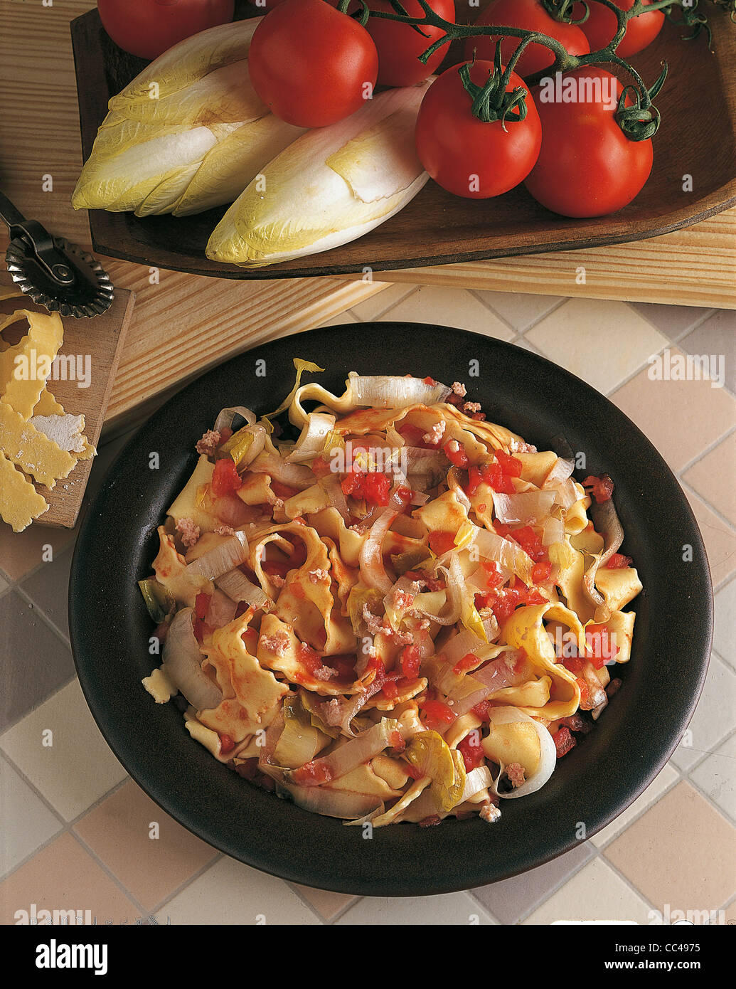 Cuisine: Pasta With Tomato Sauce And Belgian Endive Stock Photo - Alamy