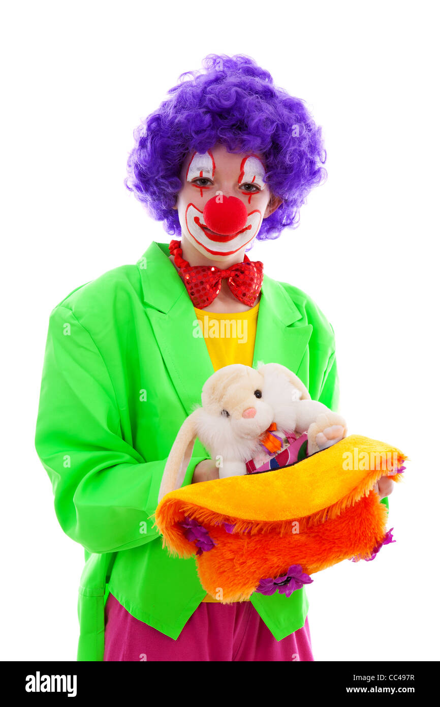 Girl Clown and magical hat over white background Stock Photo - Alamy