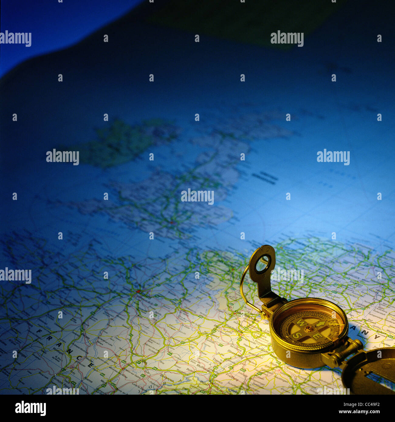 Open Compass placed on Map of the World Stock Photo - Alamy