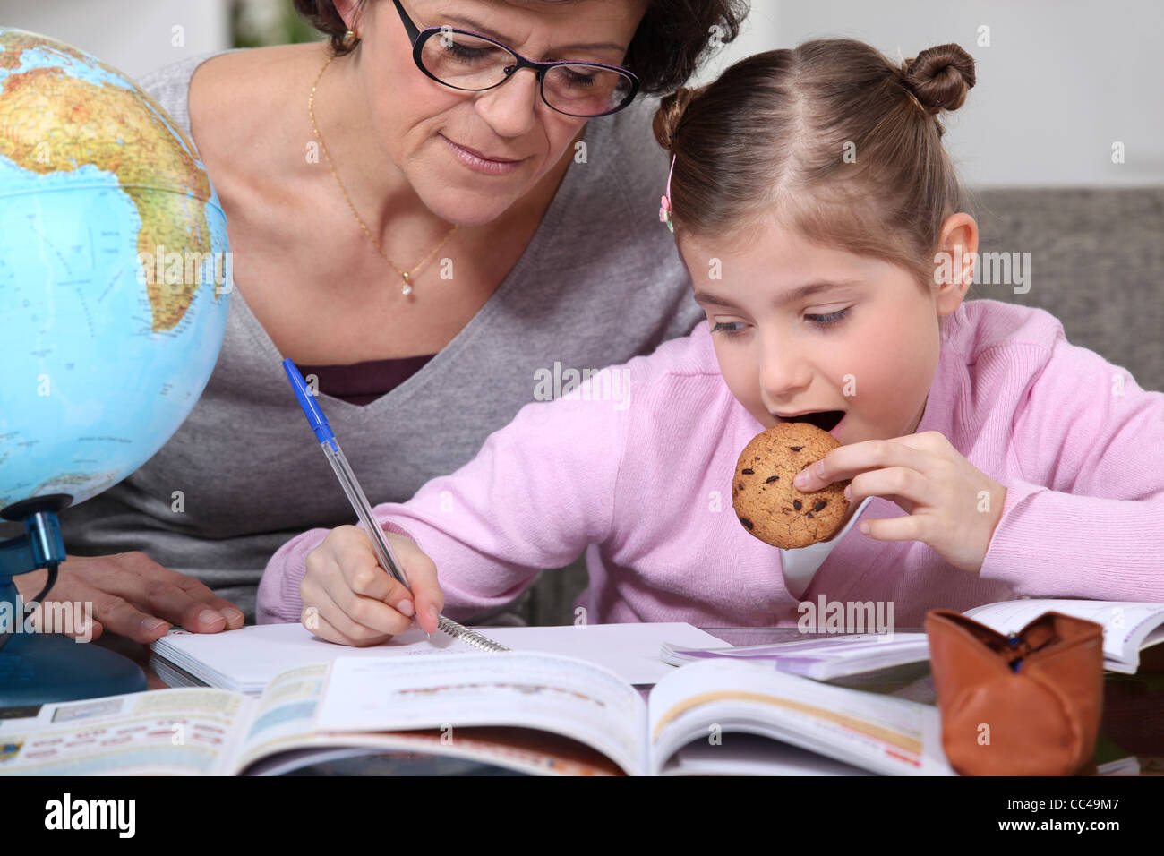 Little girl doing homework Stock Photo - Alamy