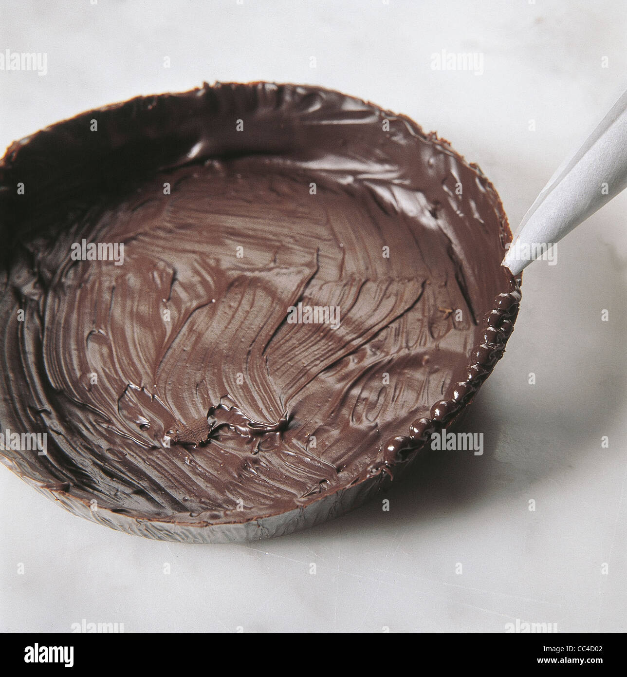 Kitchen: Chocolate Basket With 4 Puffs Stock Photo - Alamy