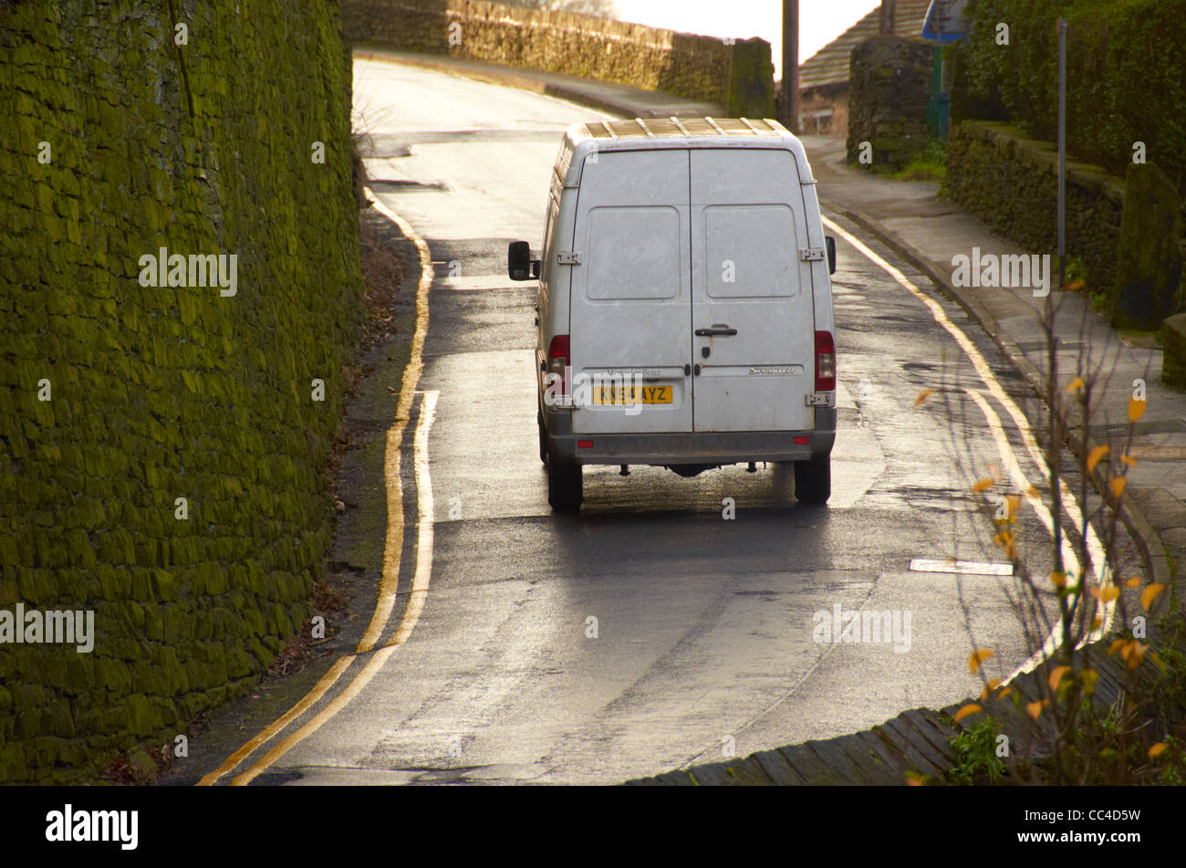 White van going up a steep hill in Holmfirth, West Yorkshire Stock ...
