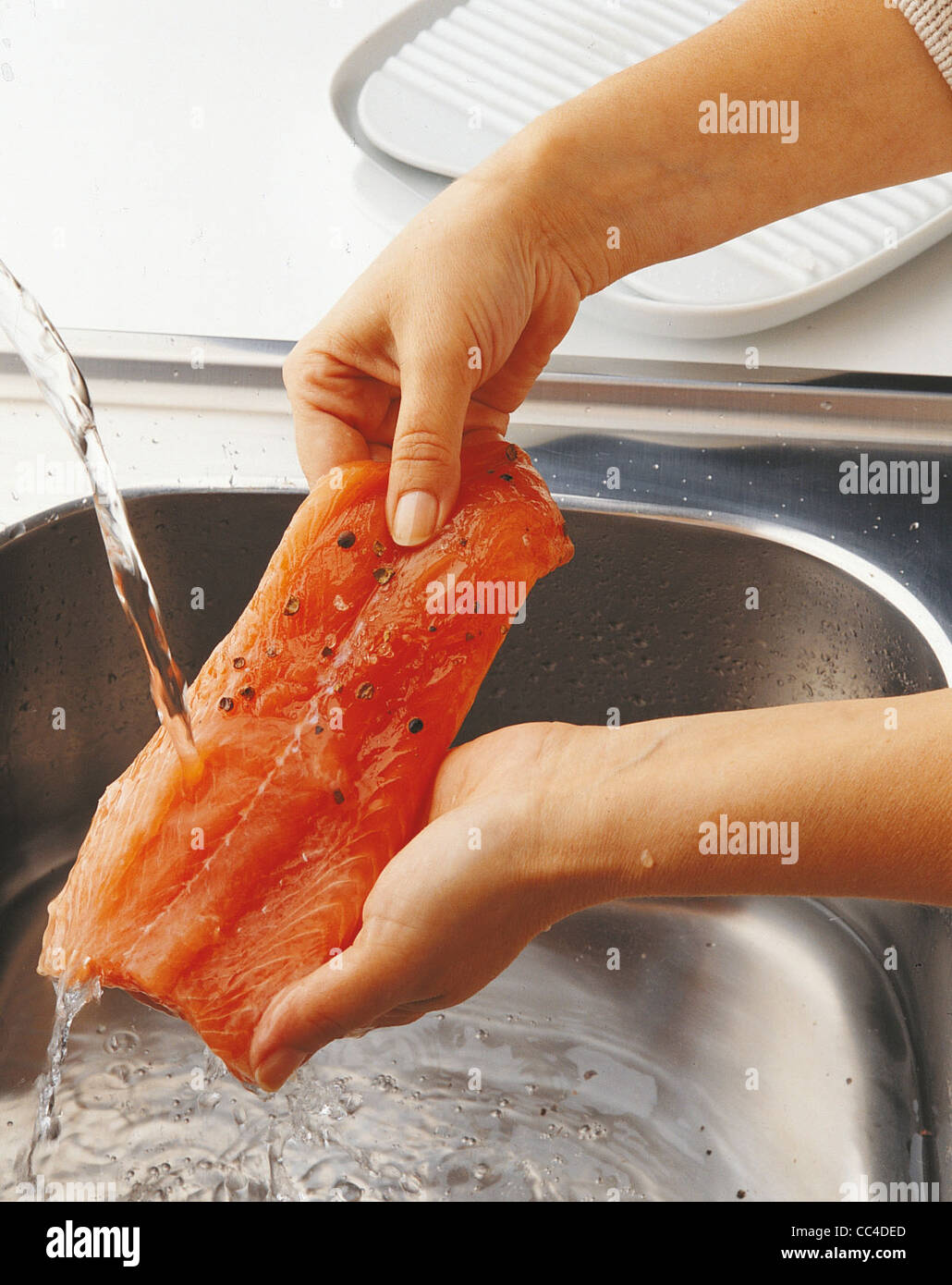 Cuisine: Marinating The Fish (3 Stock Photo - Alamy