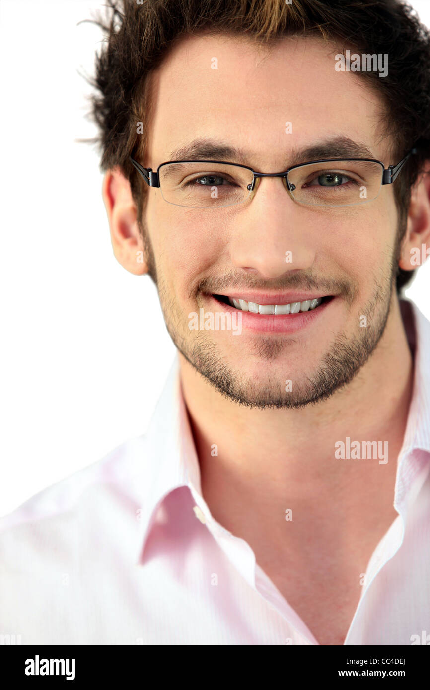 Young man wearing glasses Stock Photo - Alamy