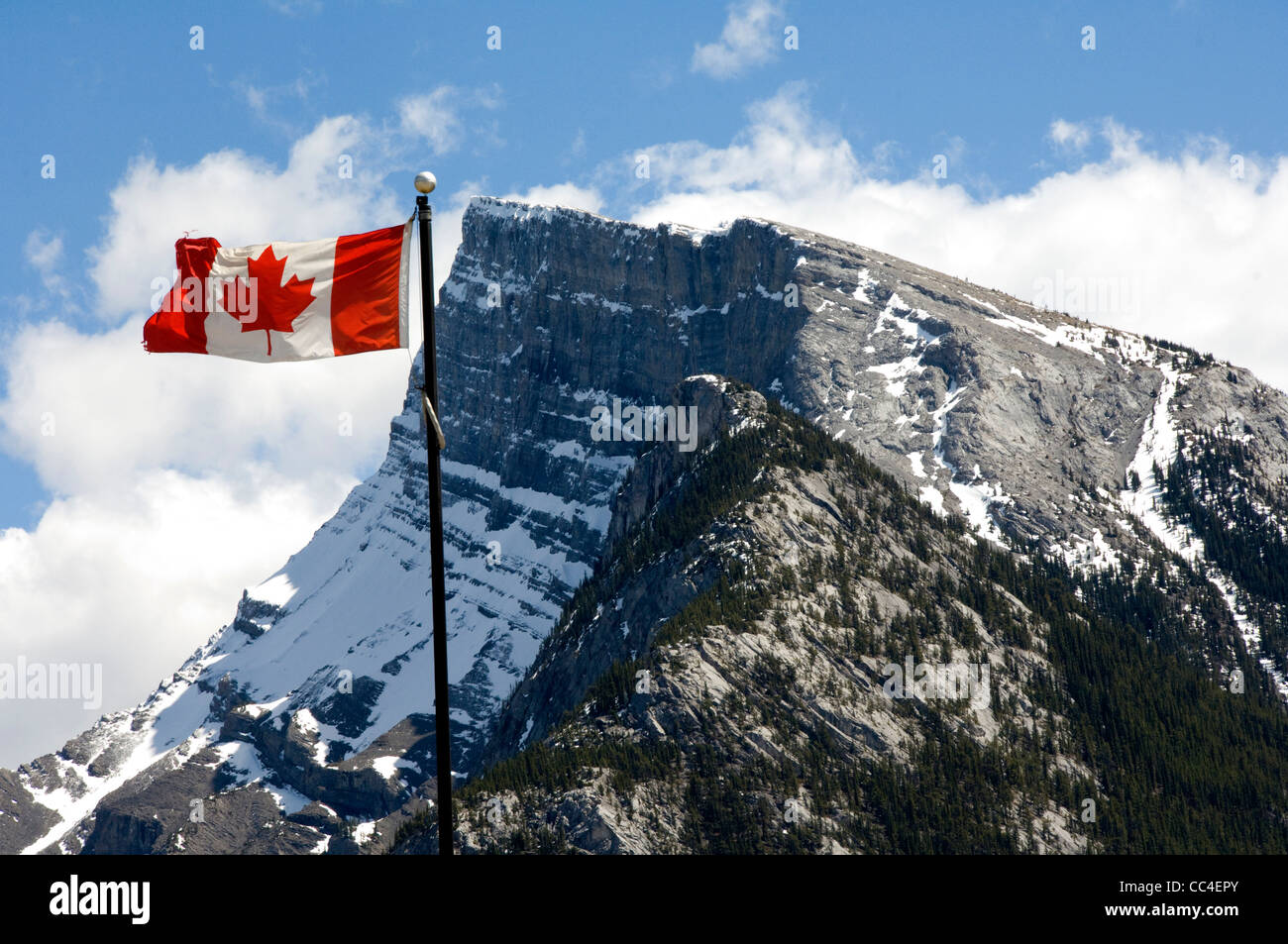 Canadian flag flying over the Rockies in Banff Stock Photo - Alamy