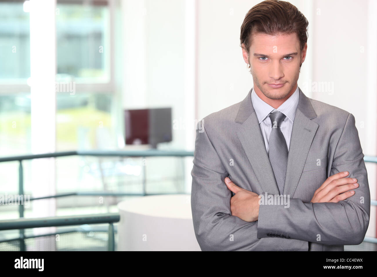 Confident young male executive Stock Photo - Alamy