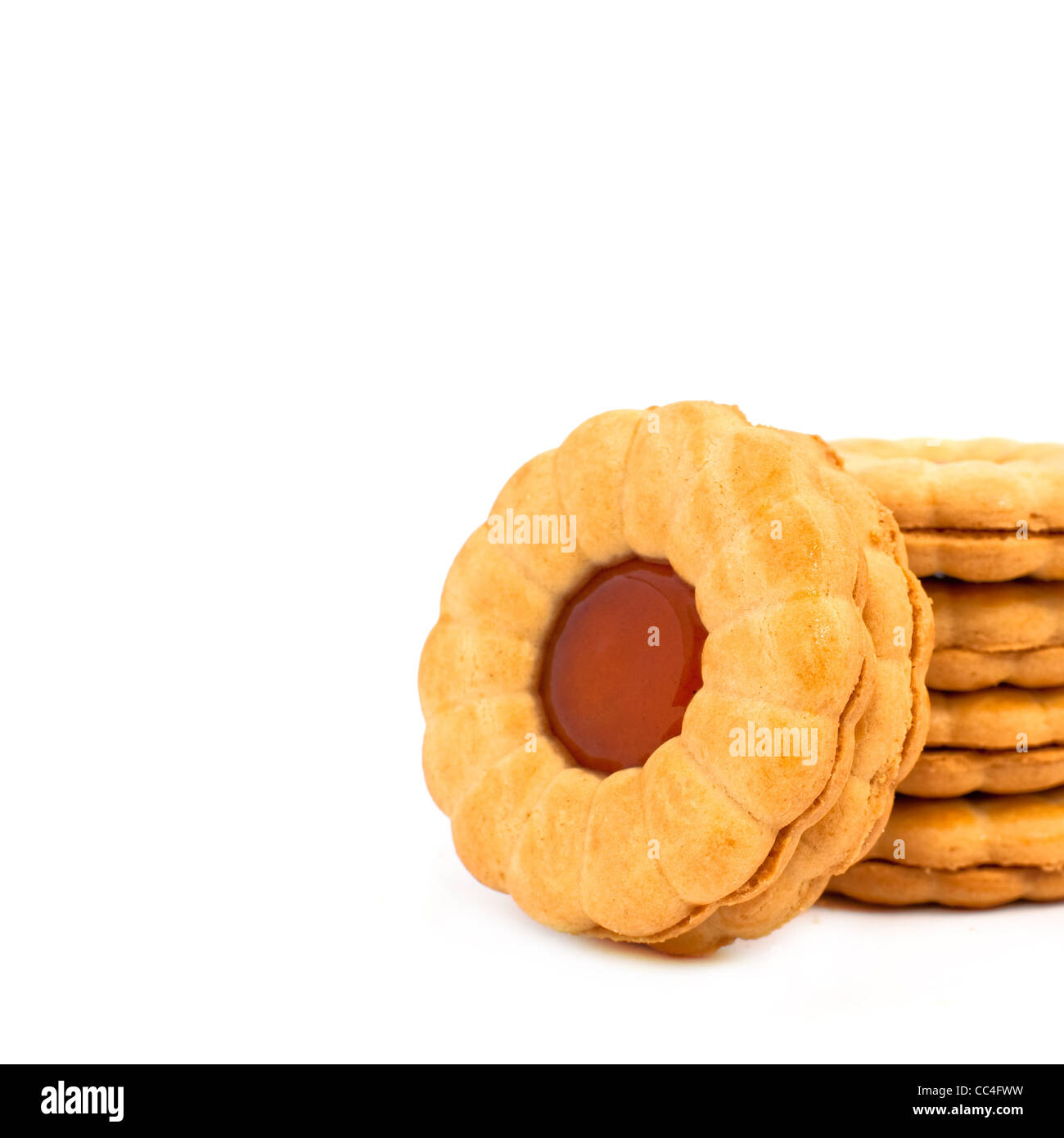 Sweet flower shaped cookies with marmelade fillings over white ...