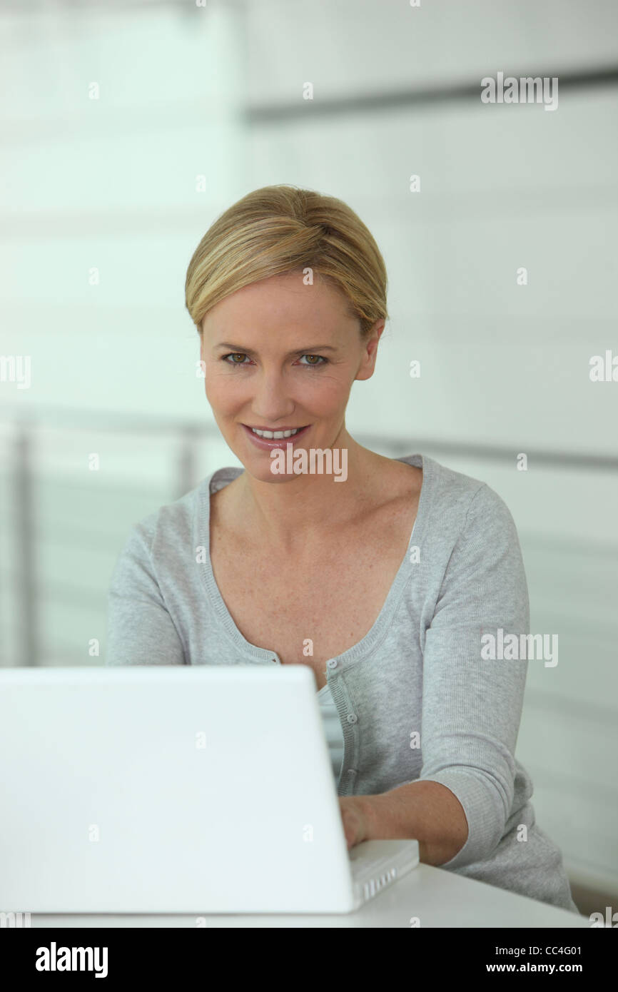 Woman on laptop Stock Photo - Alamy