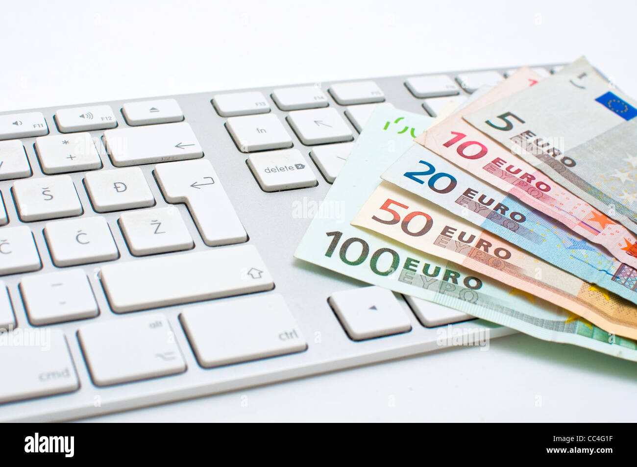 Office desktop, a computer keyboard and couple of euro bills Stock ...