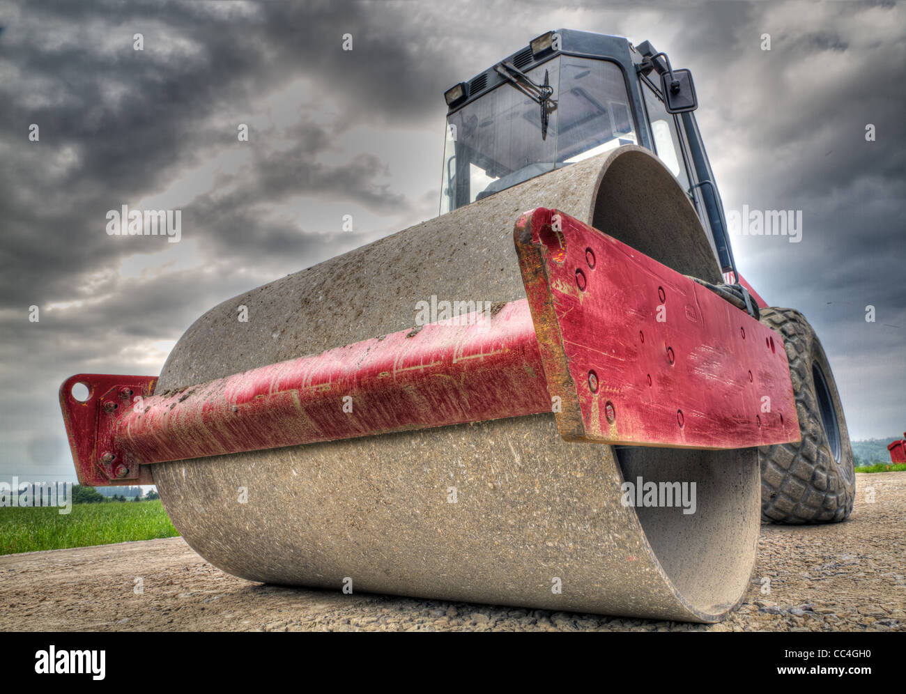 road roller in a shot showing menacing strength, power, size, weight of ...