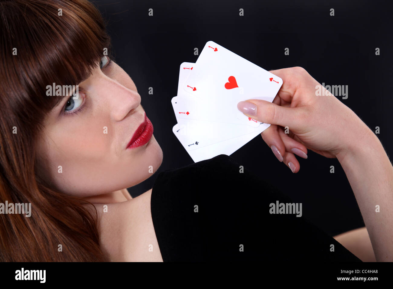 Alluring woman playing cards Stock Photo - Alamy