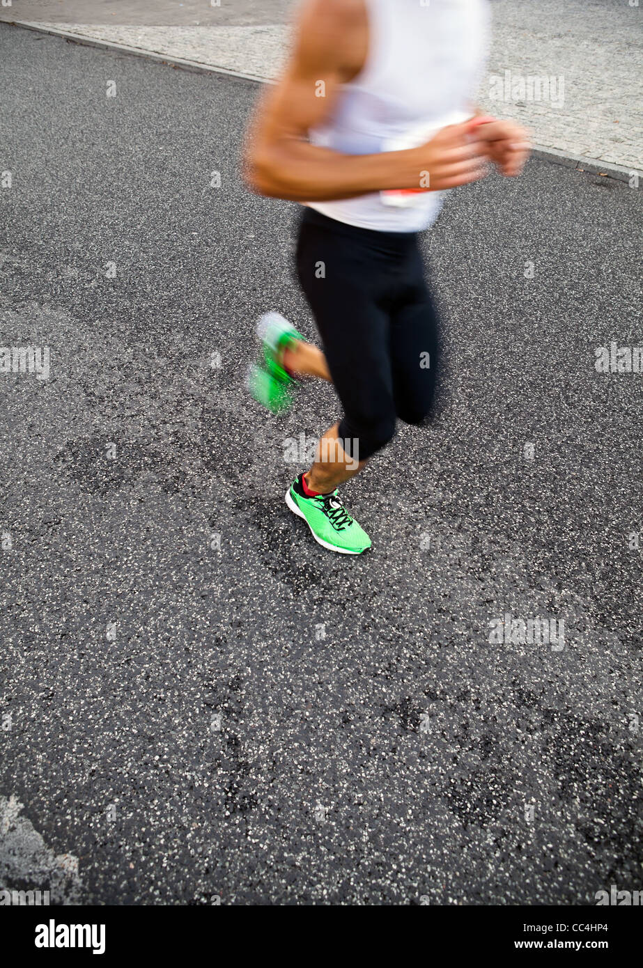 Running man on city street, motion blur Stock Photo - Alamy