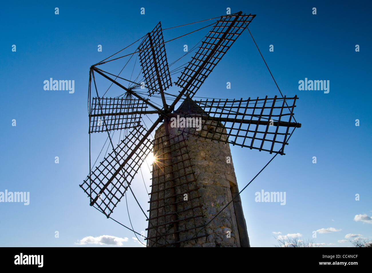 MALLORCA WINDMILL Sun breaking behind typical rustic stone windmill in ...
