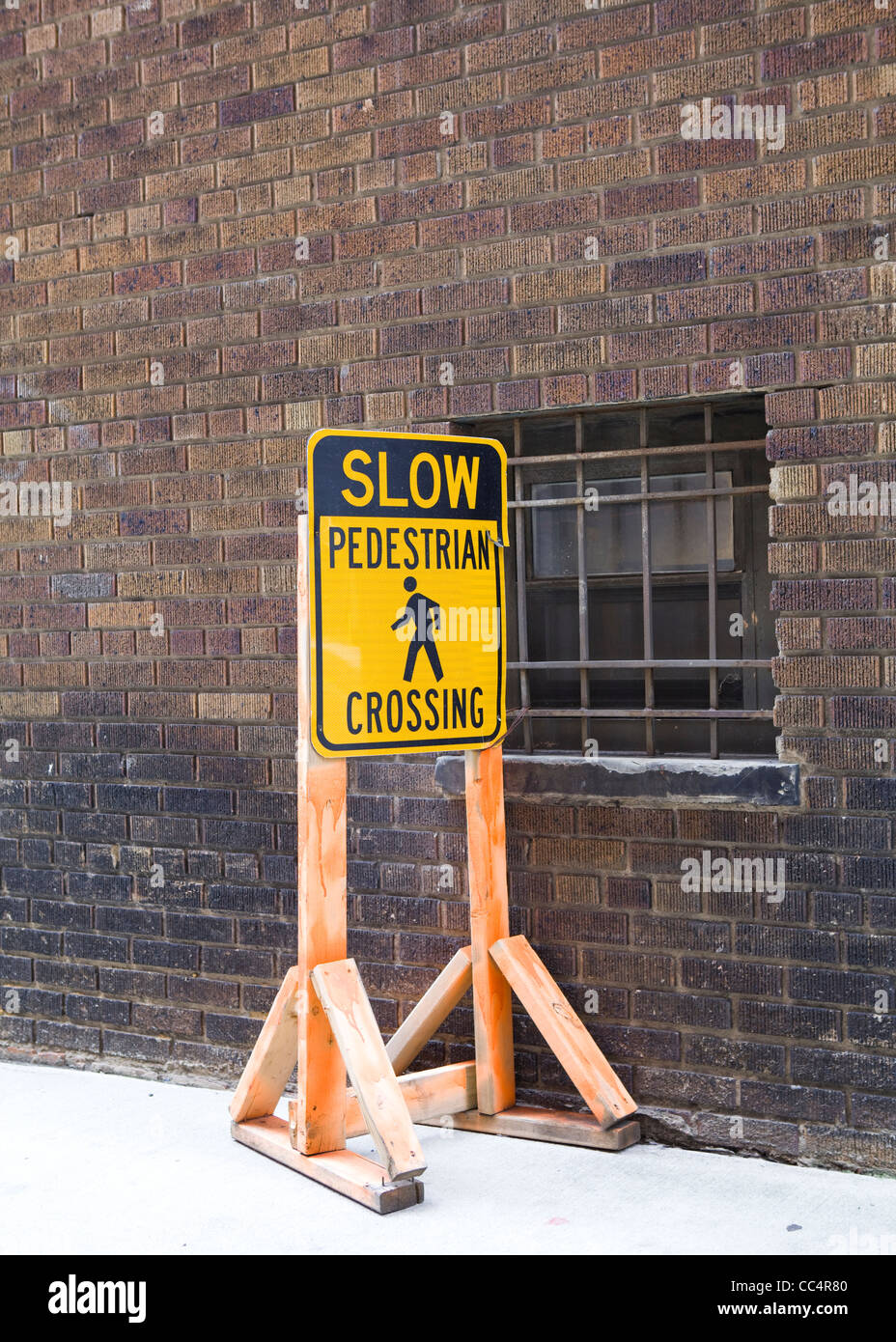 Pedestrian crossing sign next to building Stock Photo - Alamy