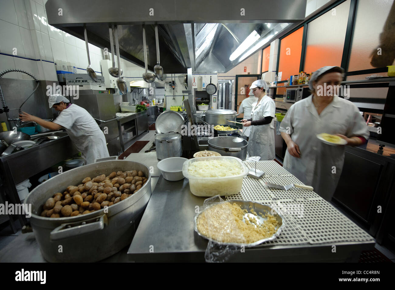 Chefs preparing food in restaurant's modern professional kitchen Stock ...