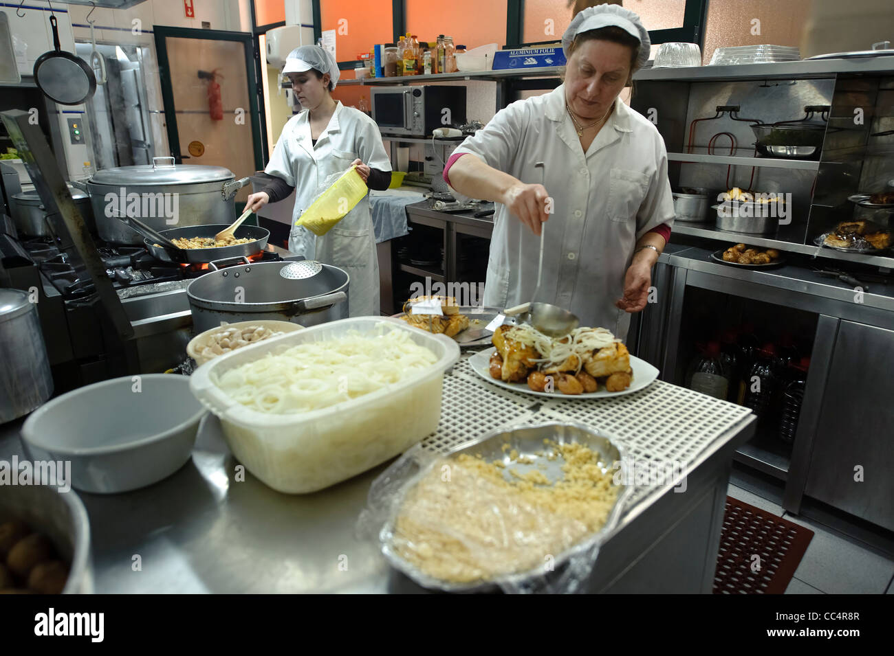 Chefs preparing food in restaurant's modern professional kitchen Stock ...