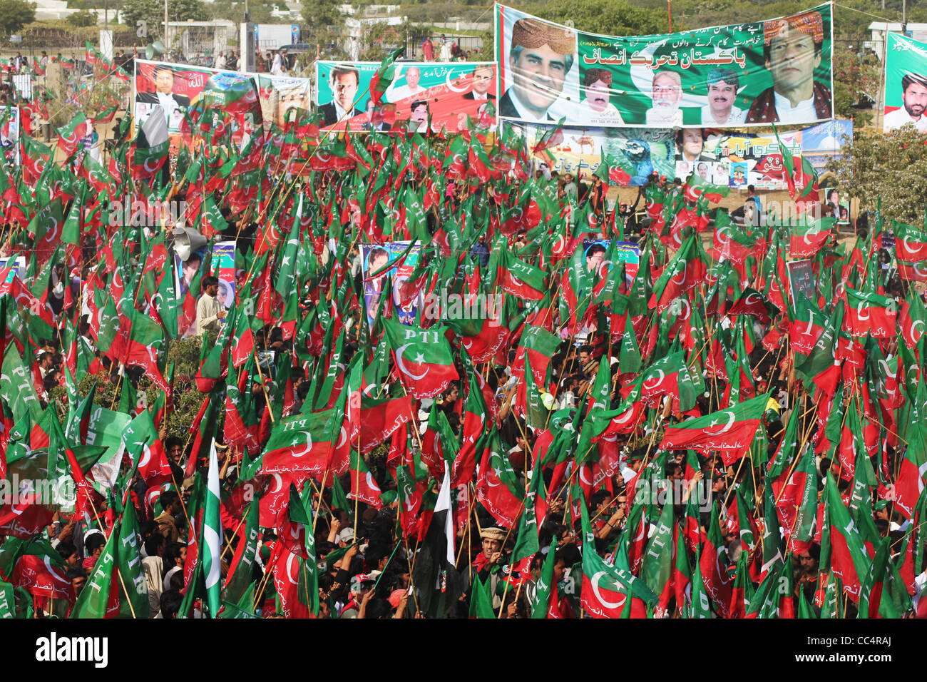 Hundreds of thousands of supporters wave party flags at a rally held by ...