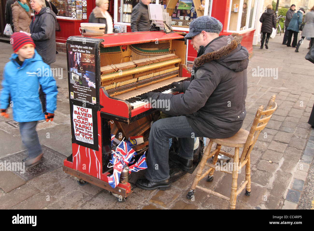 busker playing piano in street York UK Stock Photo - Alamy